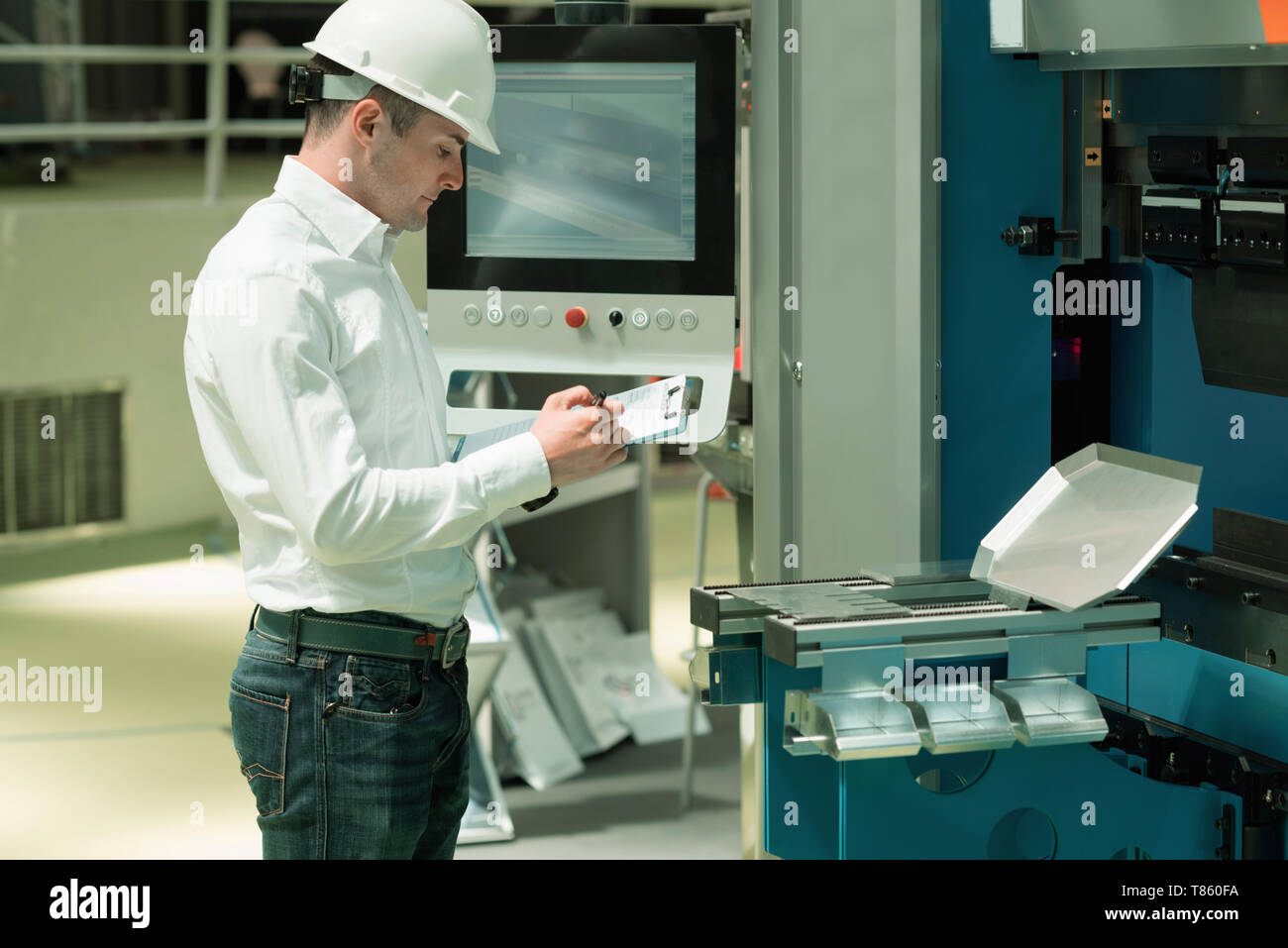 Engineer working in factory Stock Photo - Alamy