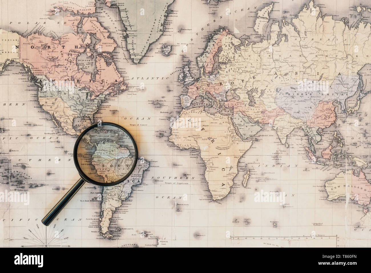 Top view of magnifying glass on world map Stock Photo - Alamy