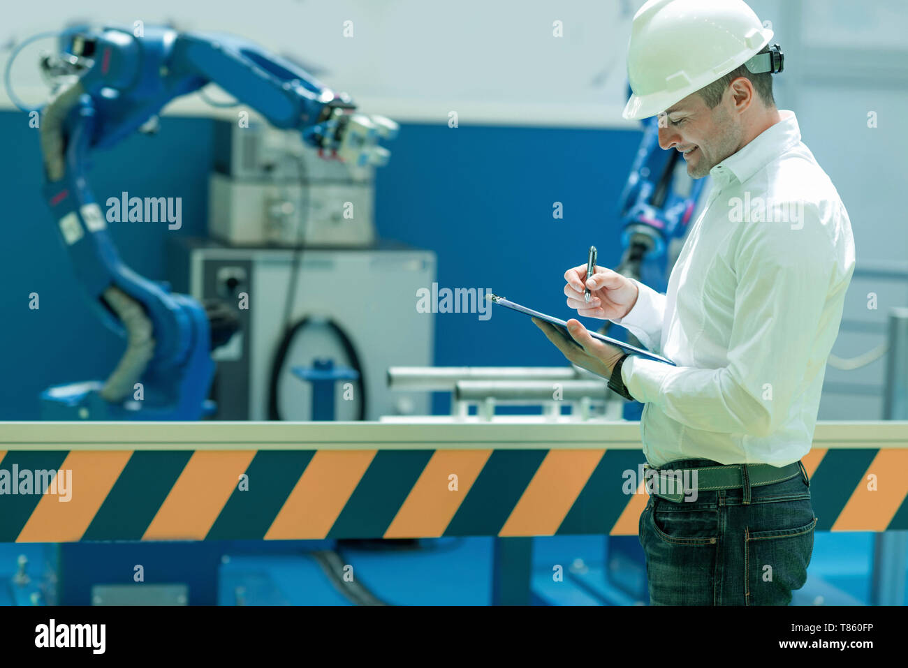 Engineer working in factory Stock Photo - Alamy