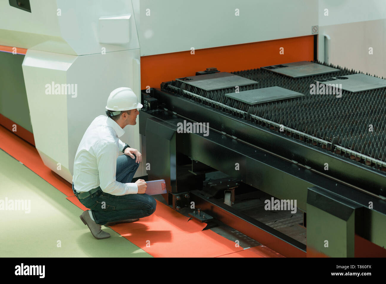 Engineer working in factory Stock Photo - Alamy