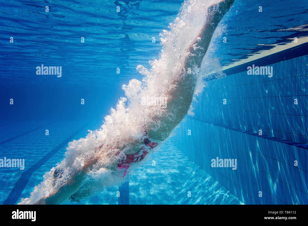 Woman diving swimming pool splash hi-res stock photography and images ...