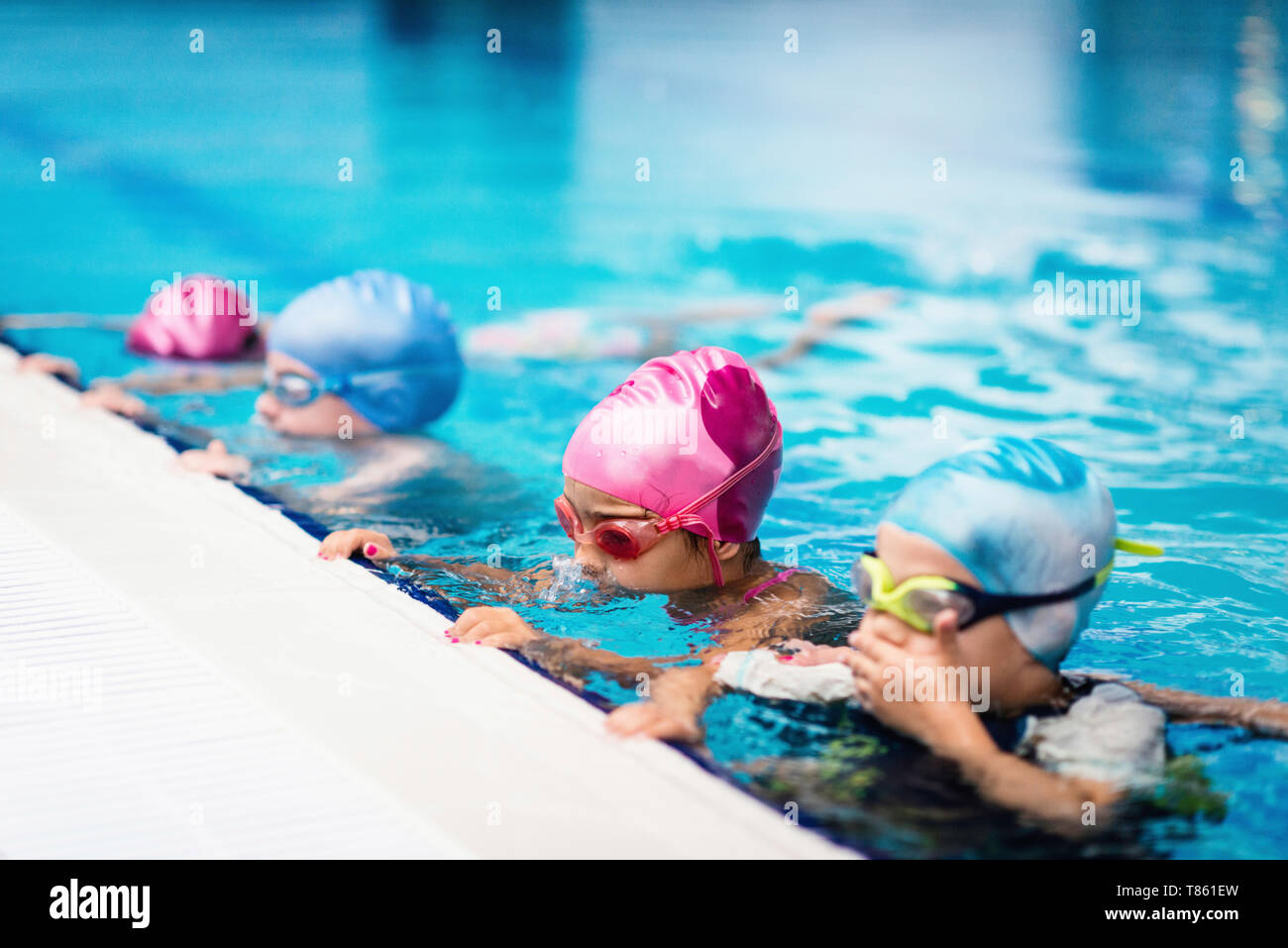 Children at edge of pool Stock Photo - Alamy