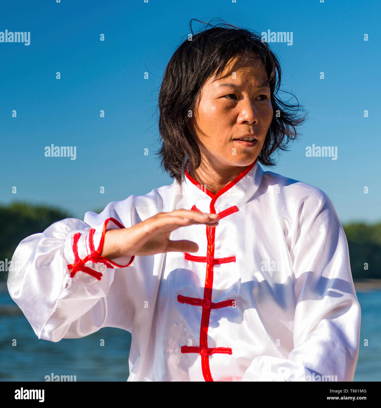 Woman practicing tai chi water hi-res stock photography and images - Alamy