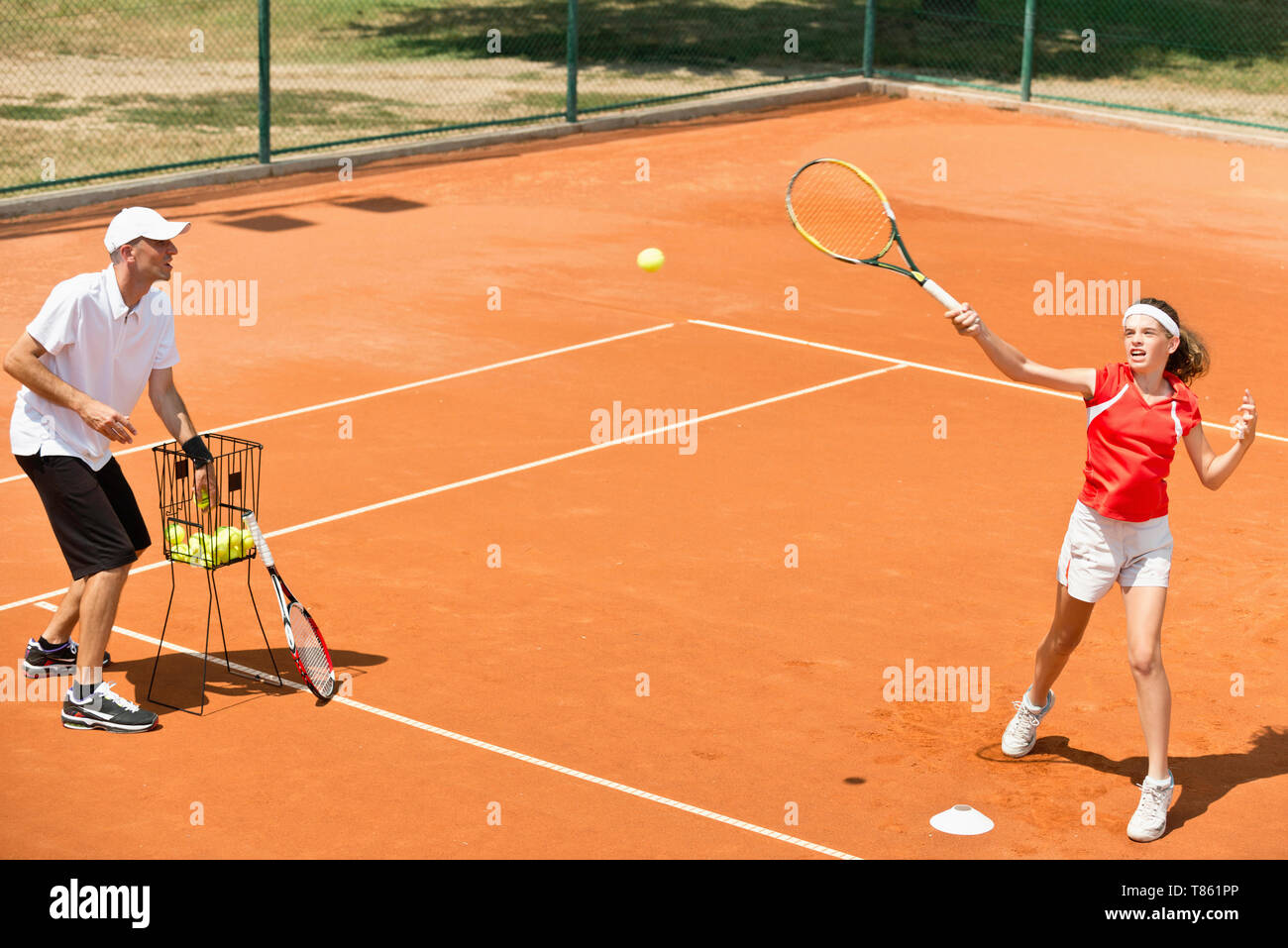 Tennis coach teenager hi-res stock photography and images - Alamy