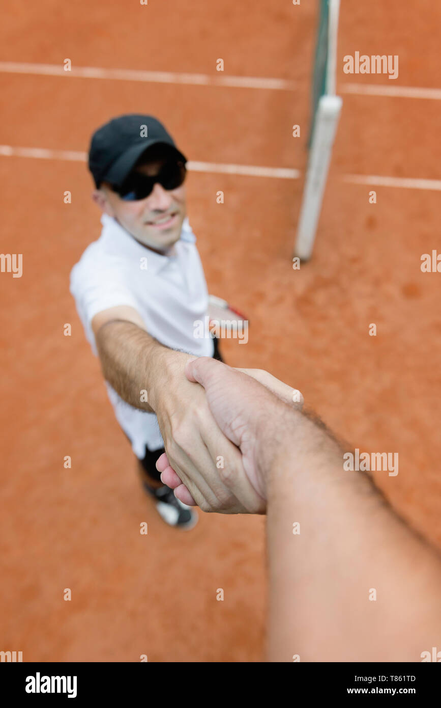Tennis player shaking hands with chair umpire Stock Photo - Alamy