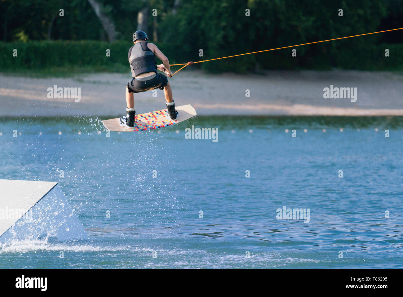 Back view of young man wakeboarding hi-res stock photography and images ...