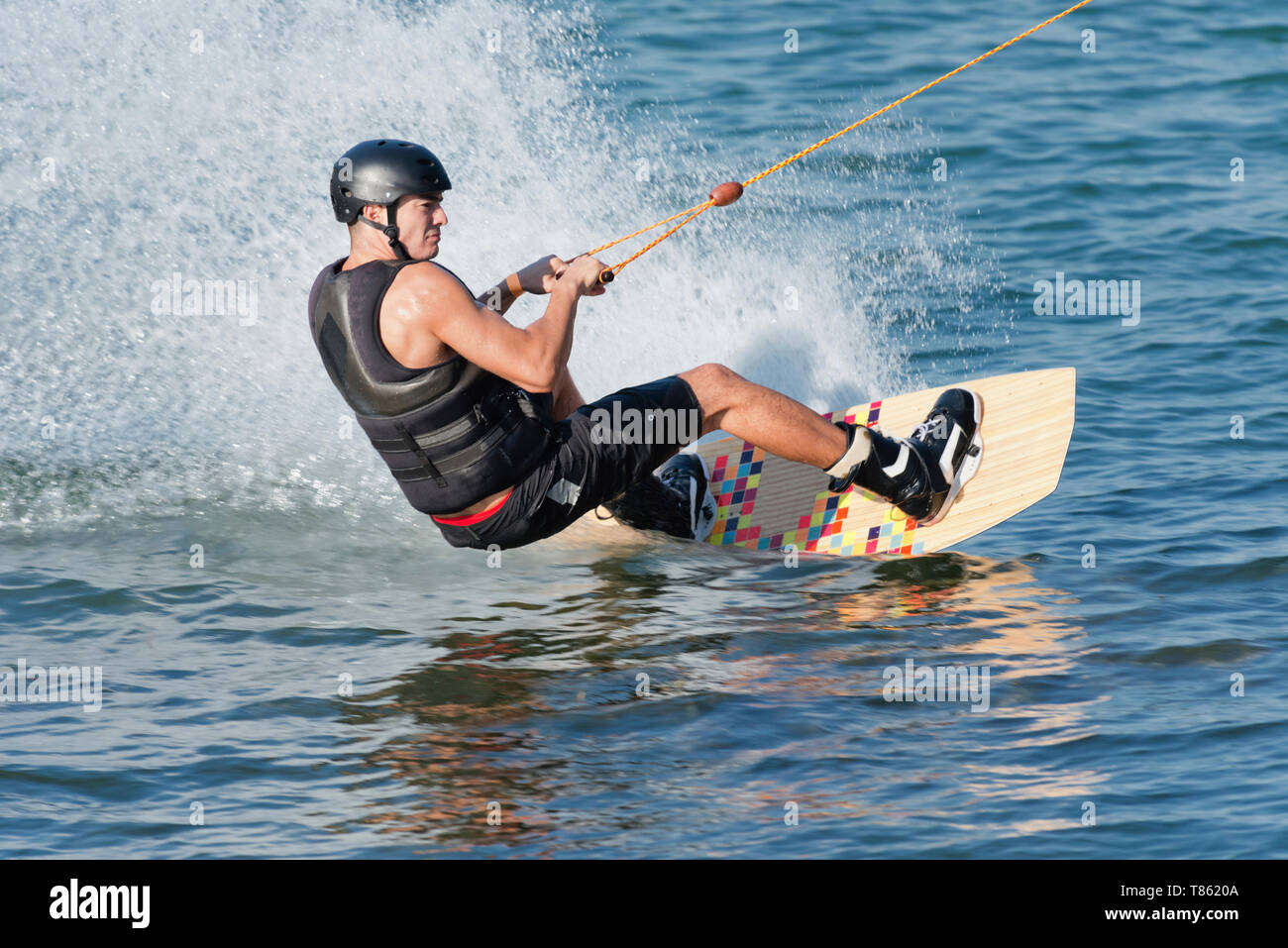 Young man wakeboarding Stock Photo - Alamy