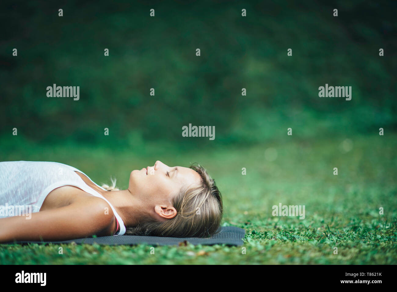 Yoga corpse pose Stock Photo - Alamy