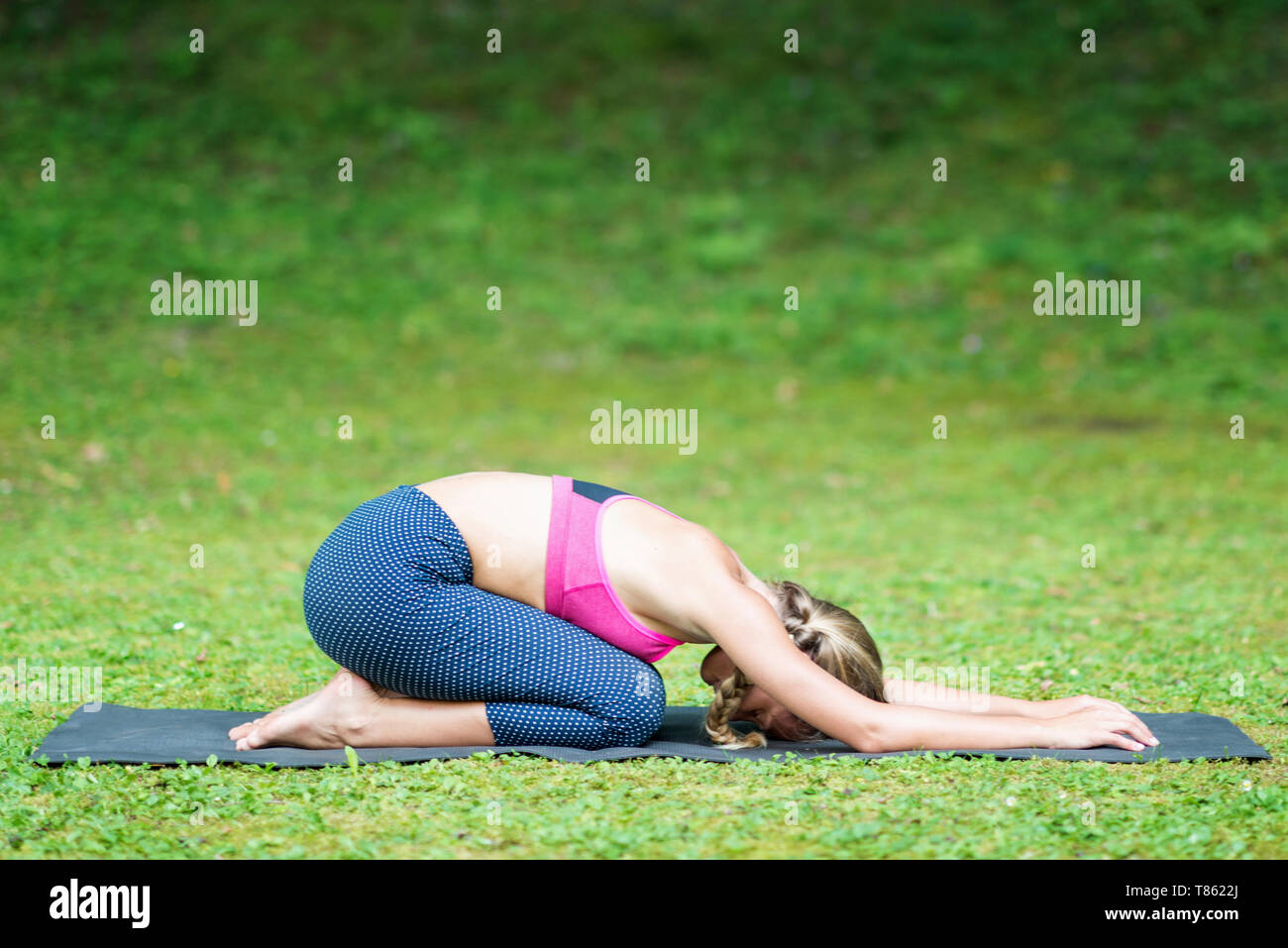 Yoga half tortoise position Stock Photo - Alamy