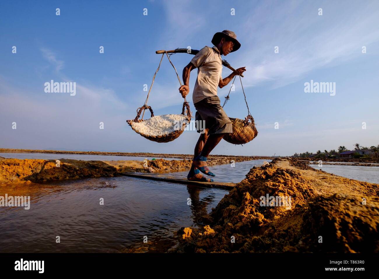 Cambodia, Kampot province, Kampot, salt pond, harvesting salt Stock ...