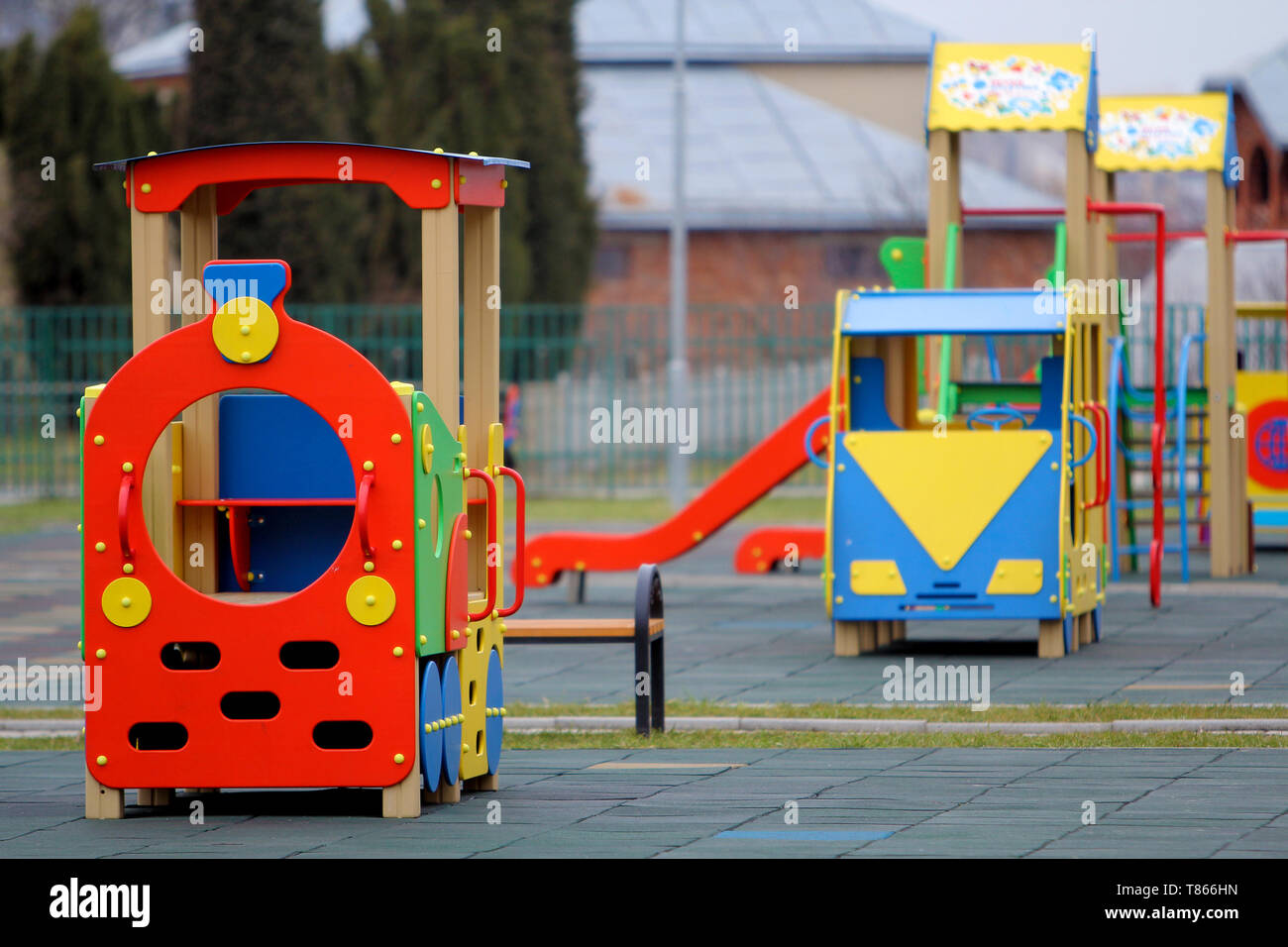 Bright colorful big toy cars on nursery playground with soft rubber ...