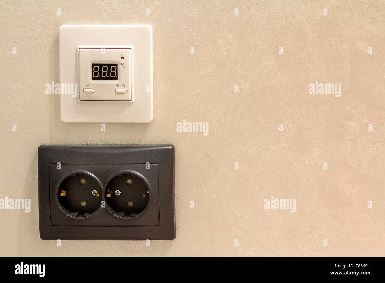 Double electric isolated socket and thermostat installed on light ...