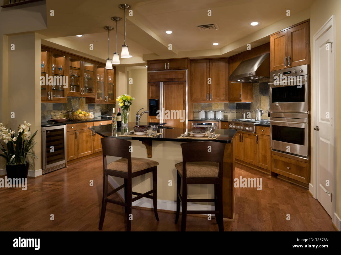 Eating Bar In Contemporary Upscale Kitchen Stock Photo - Alamy