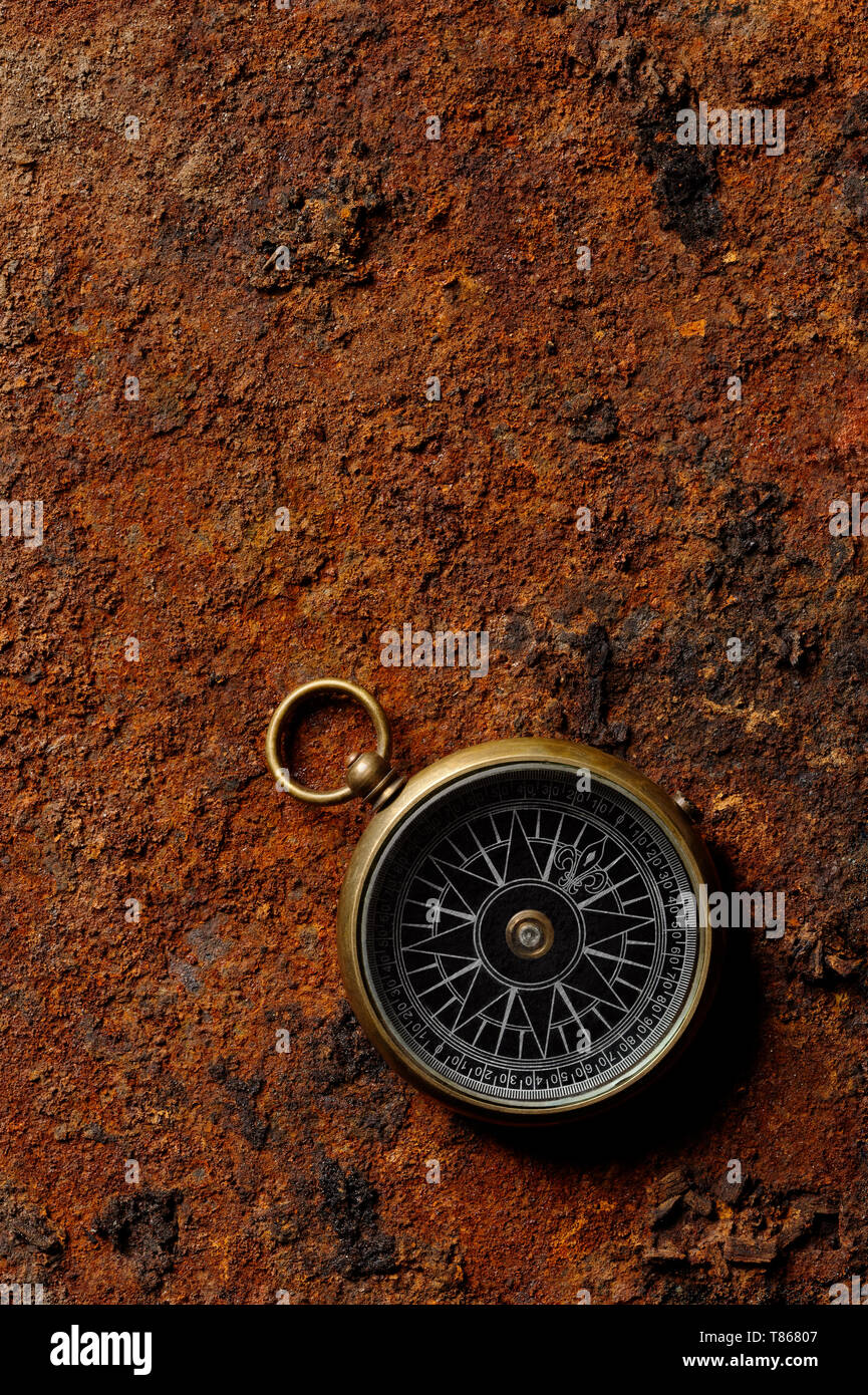 Backgrounds and textures: round magnetic compass on rough rusty map ...