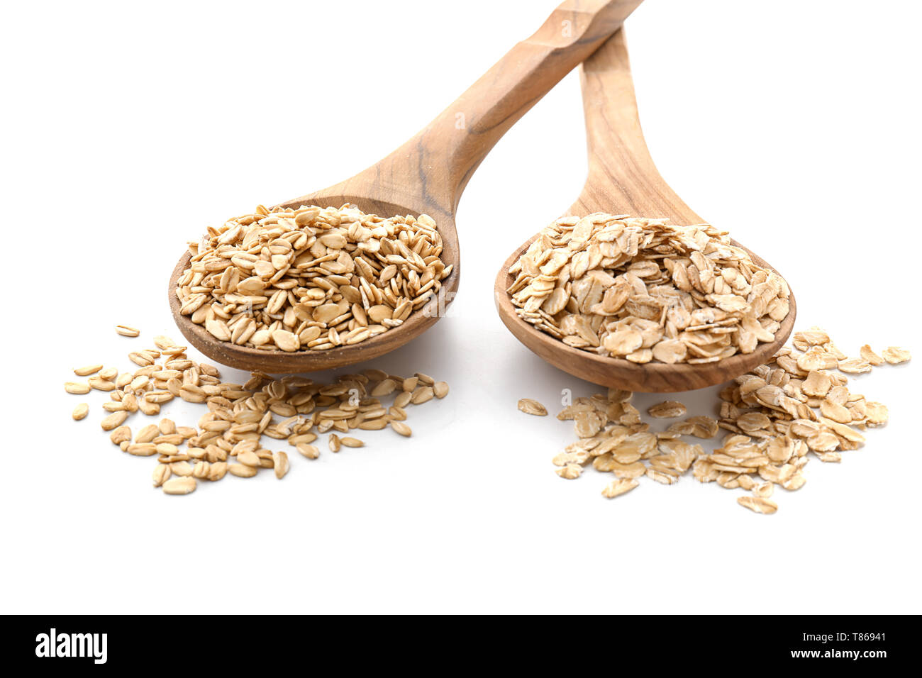 Spoons with raw oatmeal on white background Stock Photo - Alamy