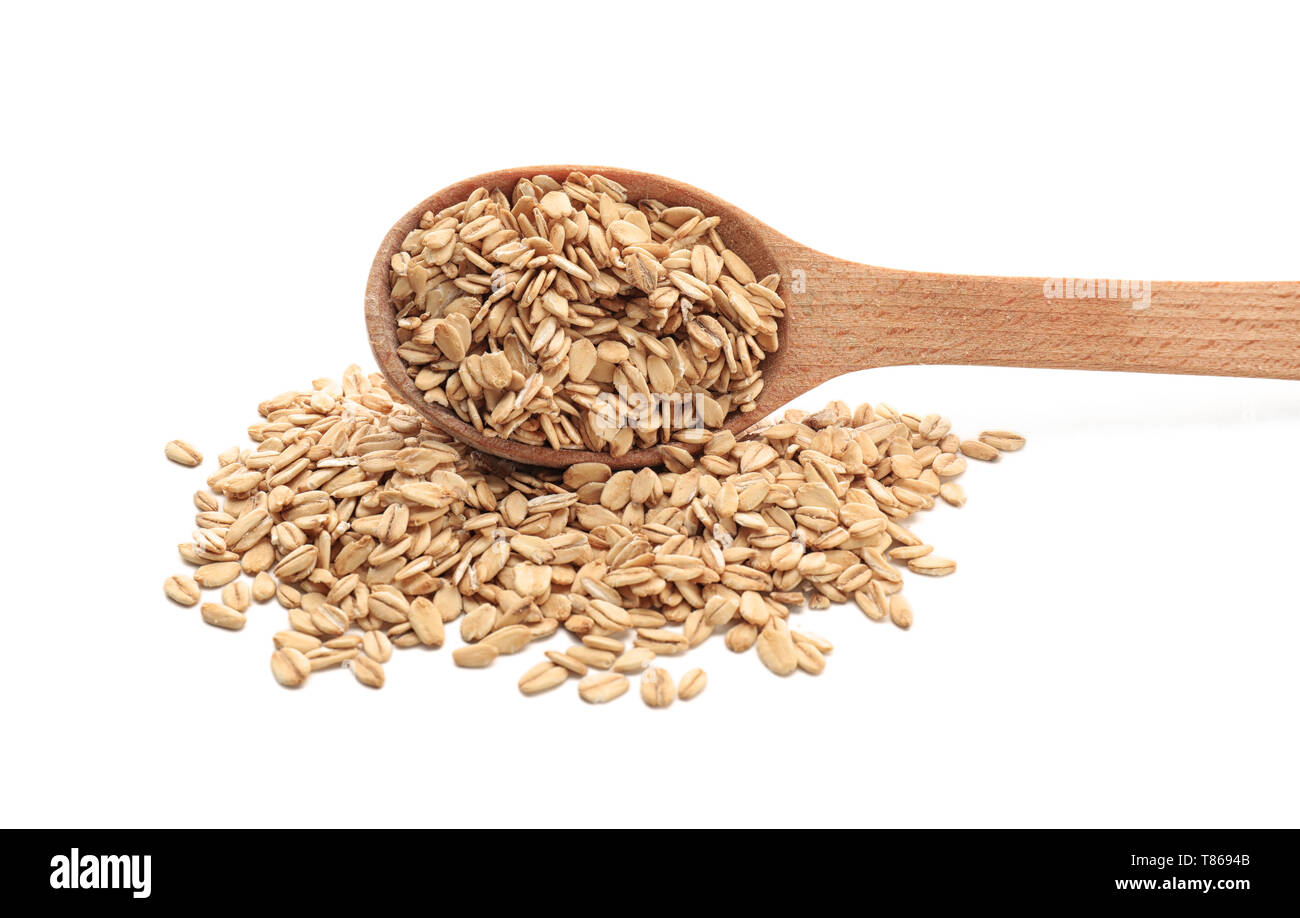 Spoon with raw oatmeal on white background Stock Photo - Alamy