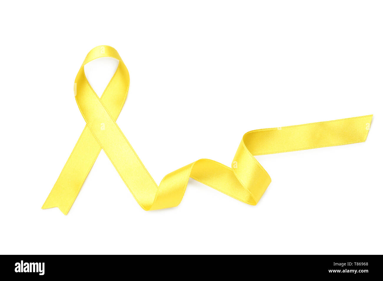 Yellow ribbon on white background. Cancer concept Stock Photo - Alamy