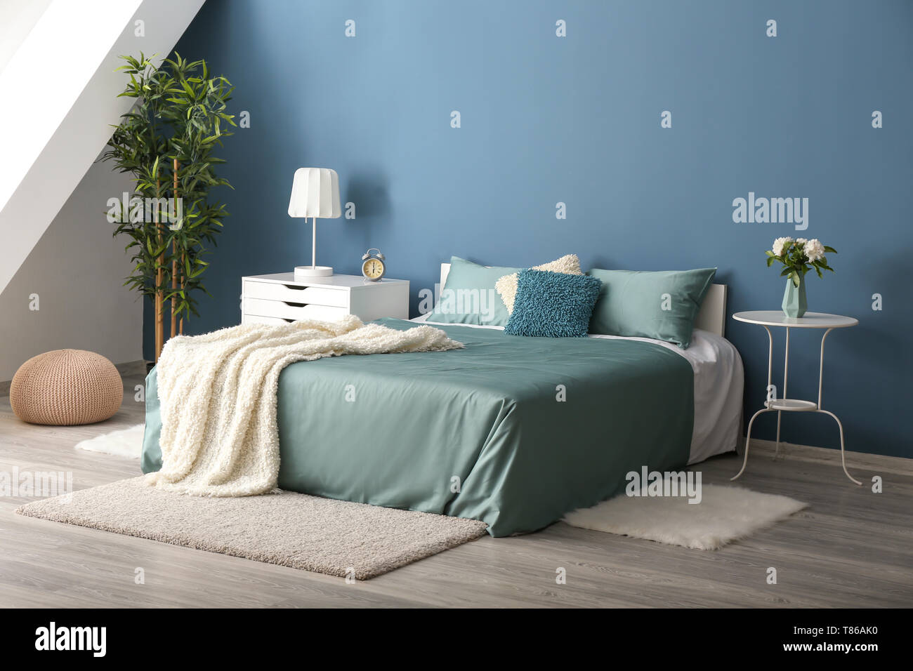 Interior of modern bedroom with comfortable bed Stock Photo - Alamy