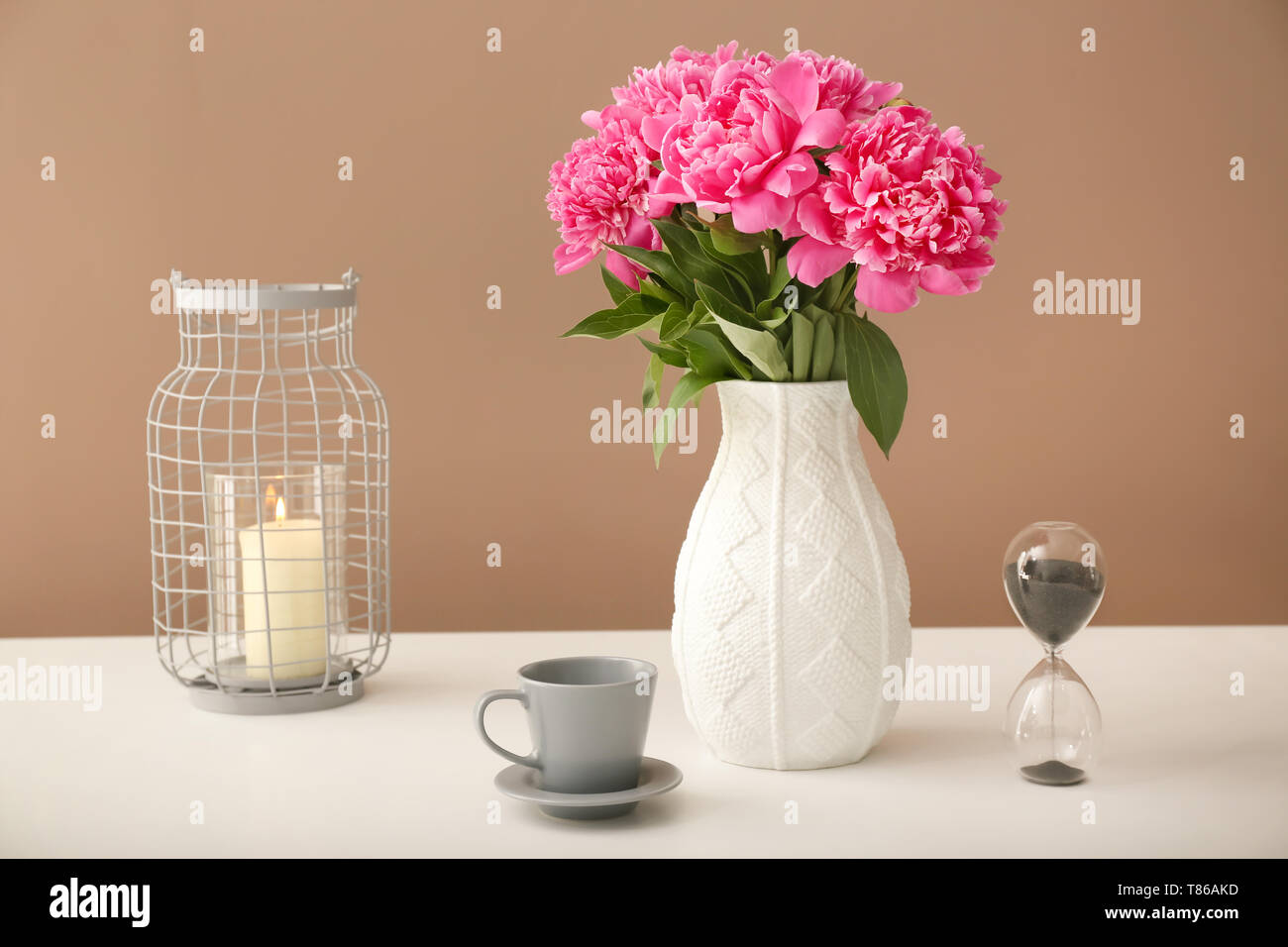 Composition with beautiful flowers on table Stock Photo - Alamy