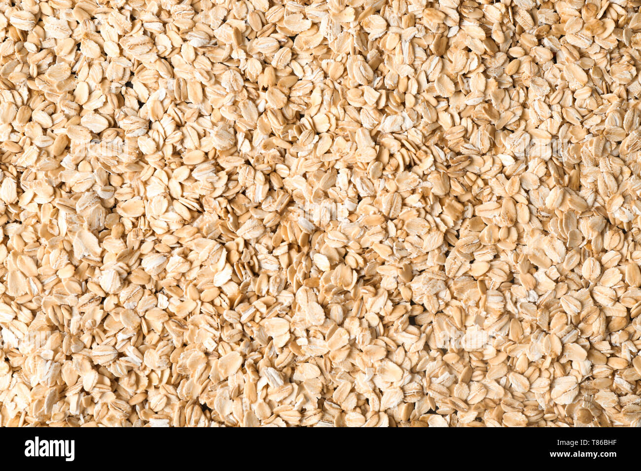 Raw oat flakes Stock Photo - Alamy