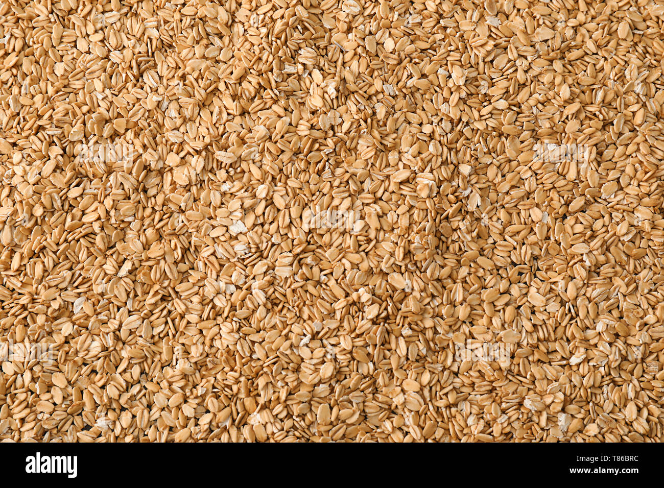 Raw oatmeal flakes Stock Photo - Alamy