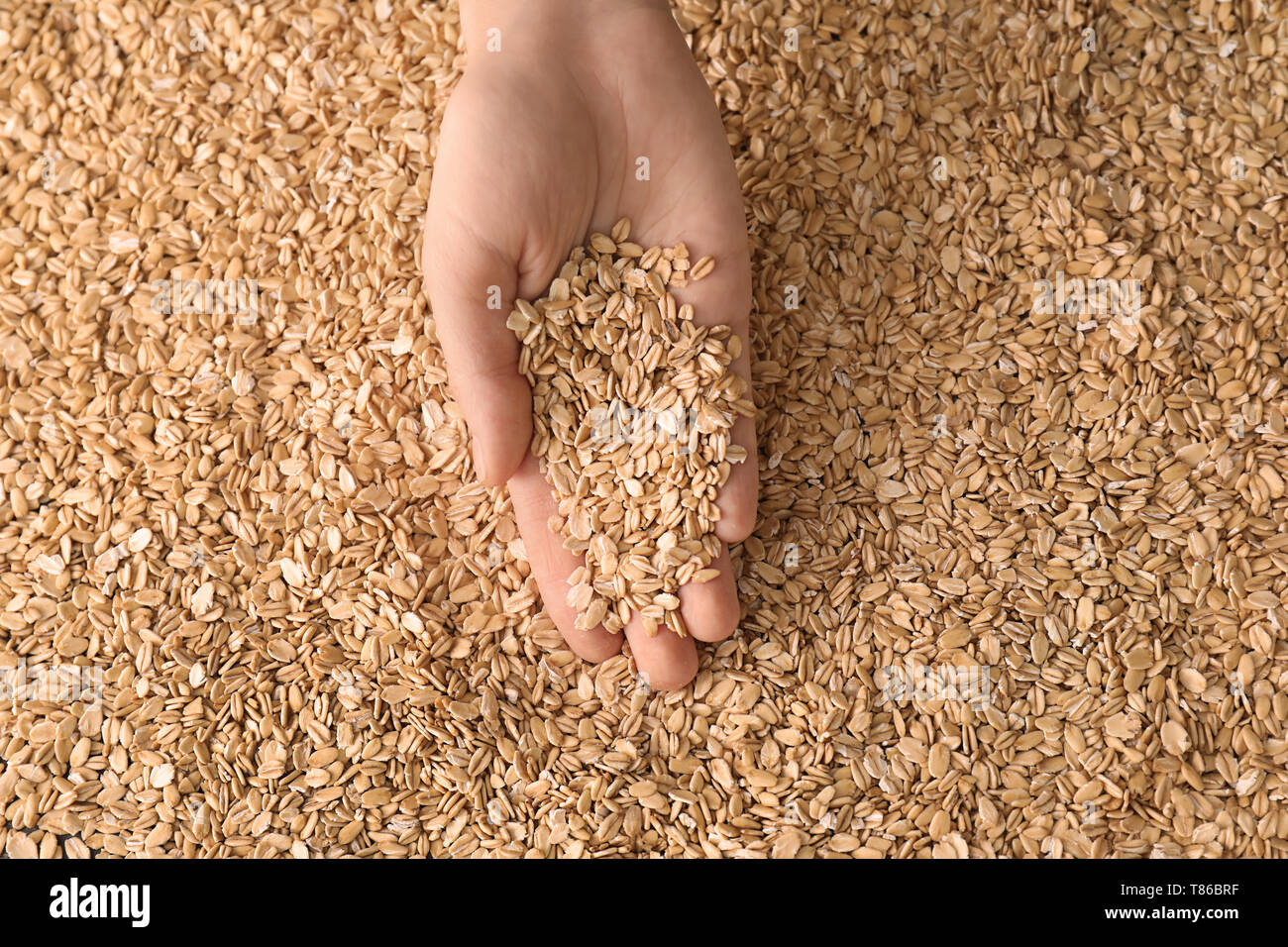 Handful of breakfast cereal healthy all bran flakes hi-res stock ...