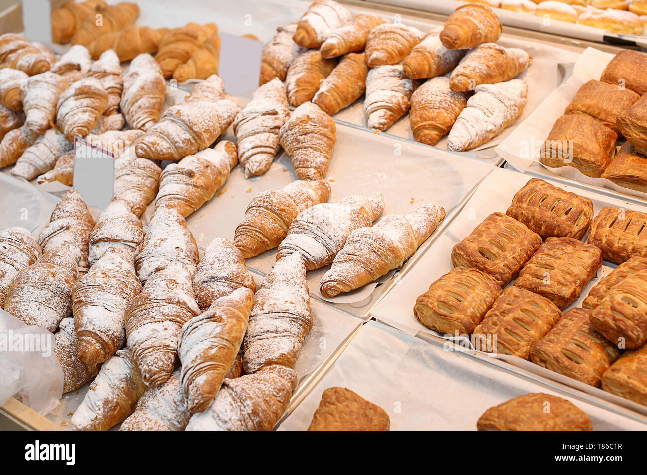 Fresh puff pastry on display in bakery Stock Photo - Alamy