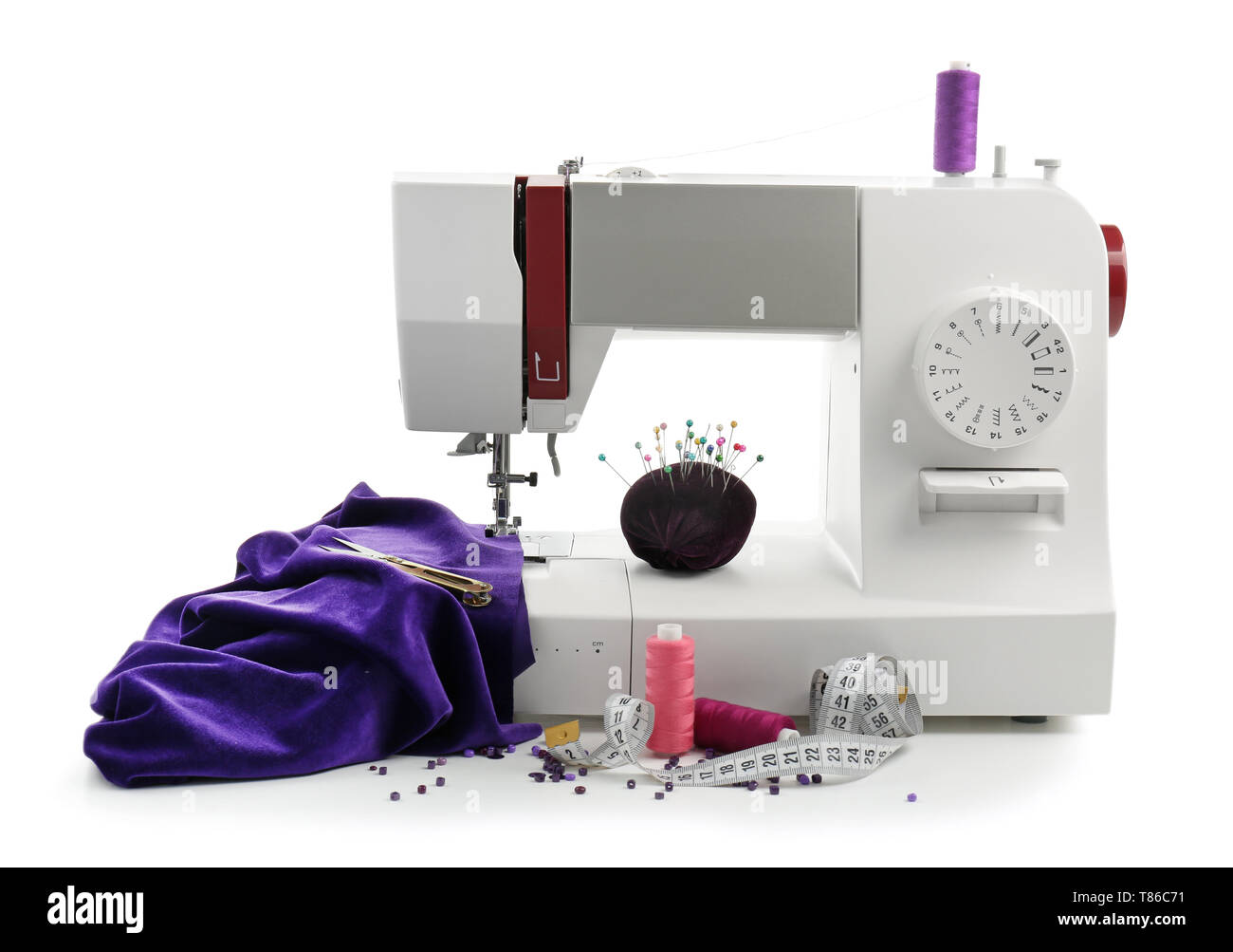 Modern sewing machine with tailor accessories on white background Stock ...