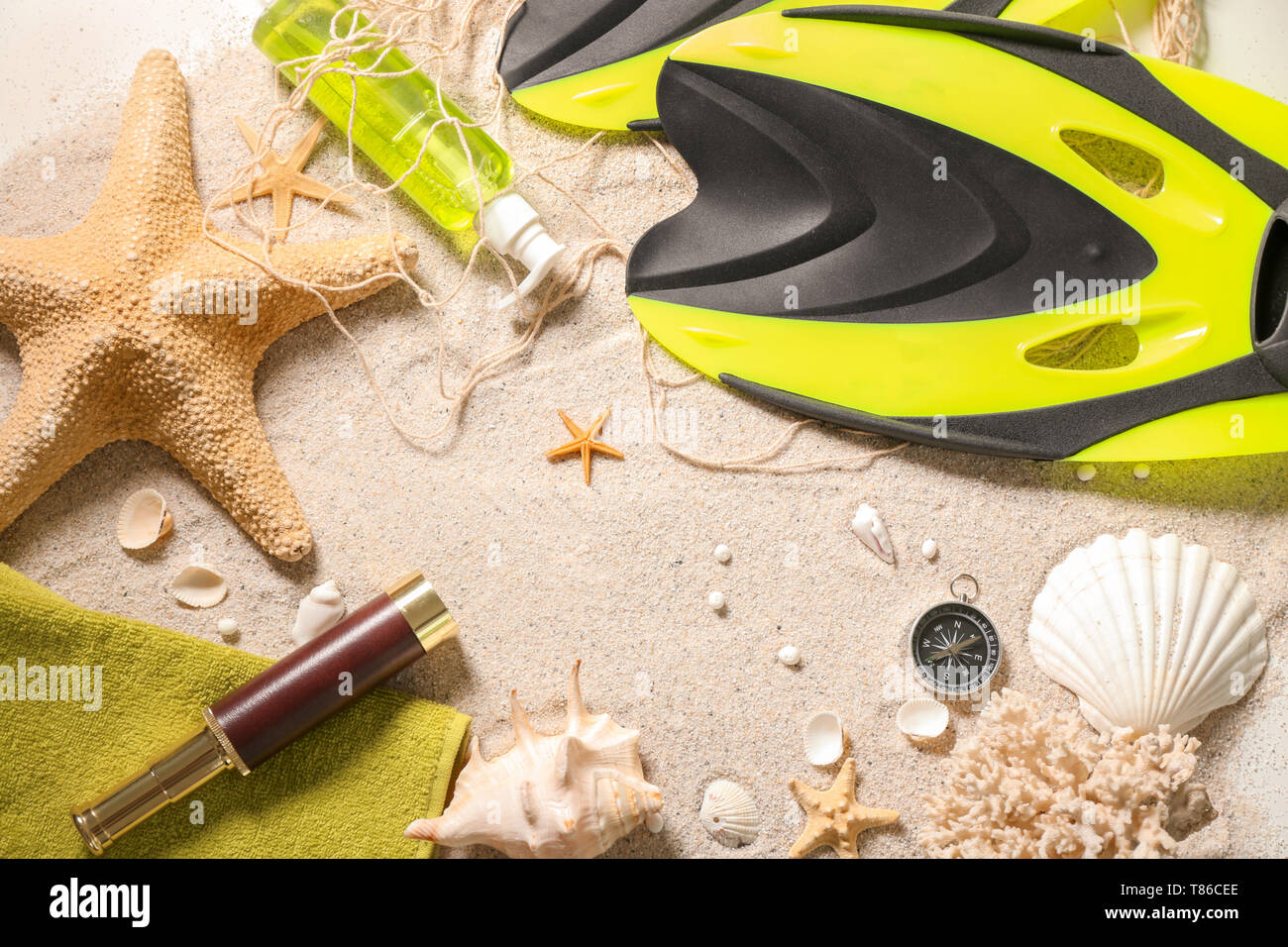 Beach accessories and sea shells on sand Stock Photo - Alamy