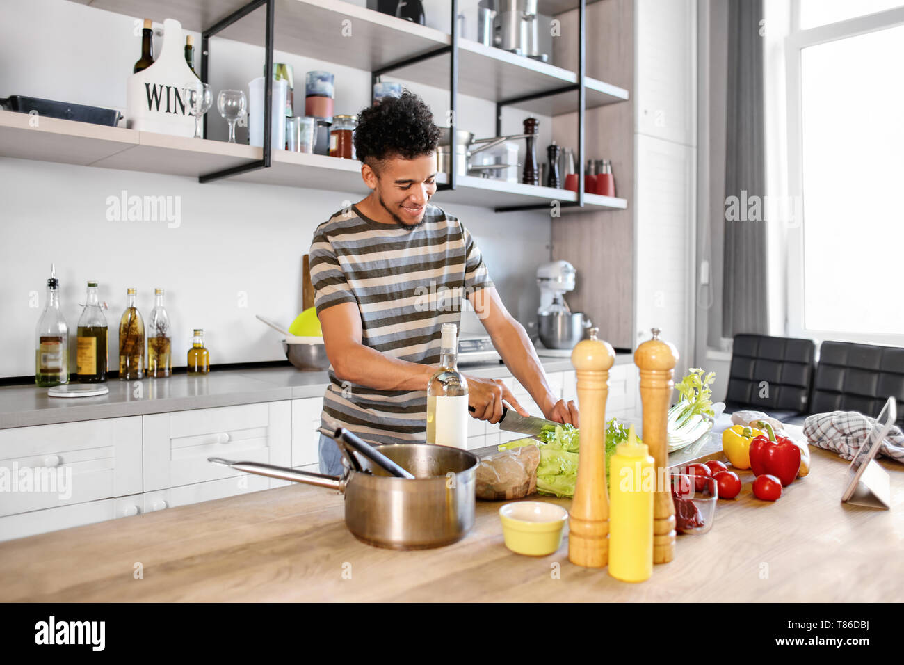 Afro man cooking knife hi-res stock photography and images - Alamy