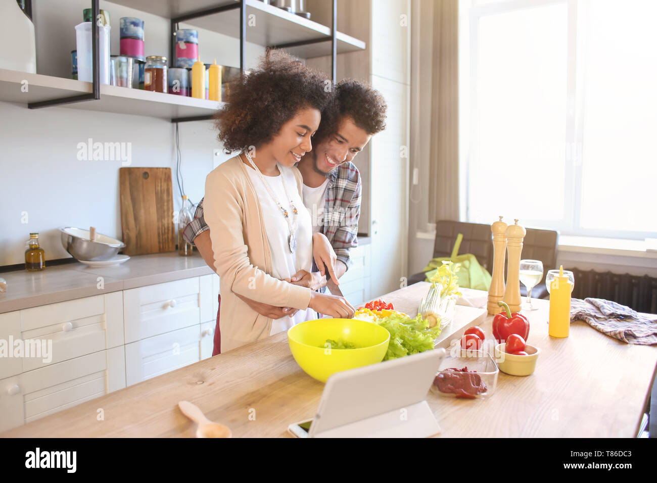 African american couple cooking cutting hi-res stock photography and ...