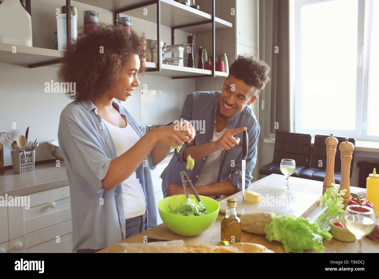 African american couple cooking cutting hi-res stock photography and ...