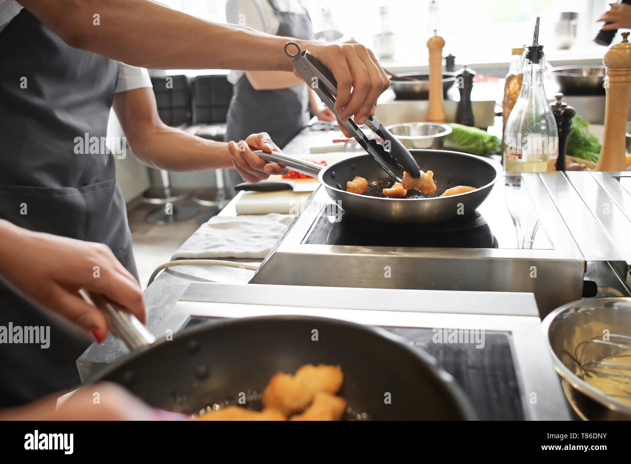 Male chef cooking in restaurant kitchen Stock Photo - Alamy