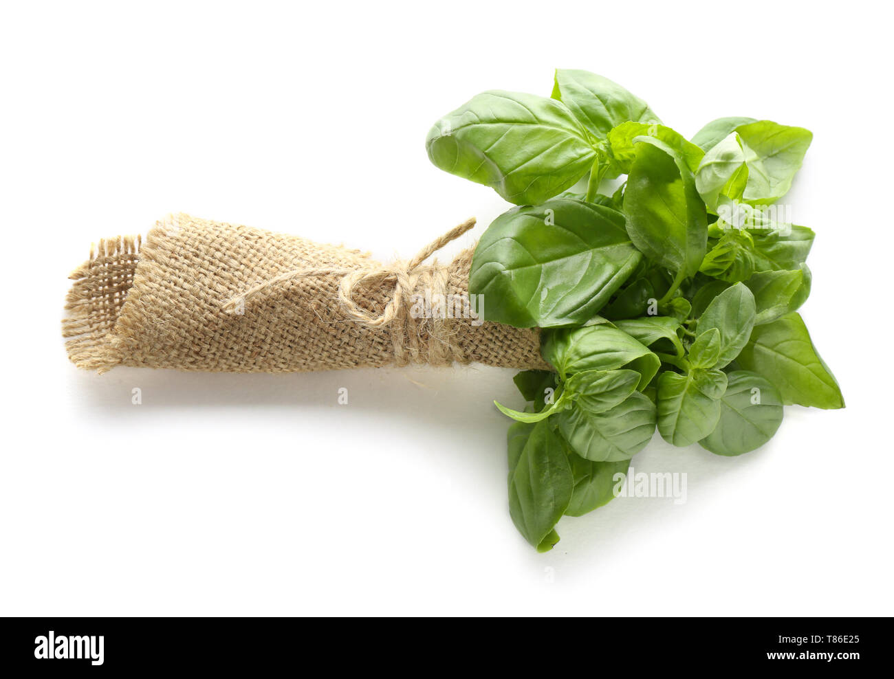 Bunch of fresh basil on white background Stock Photo - Alamy