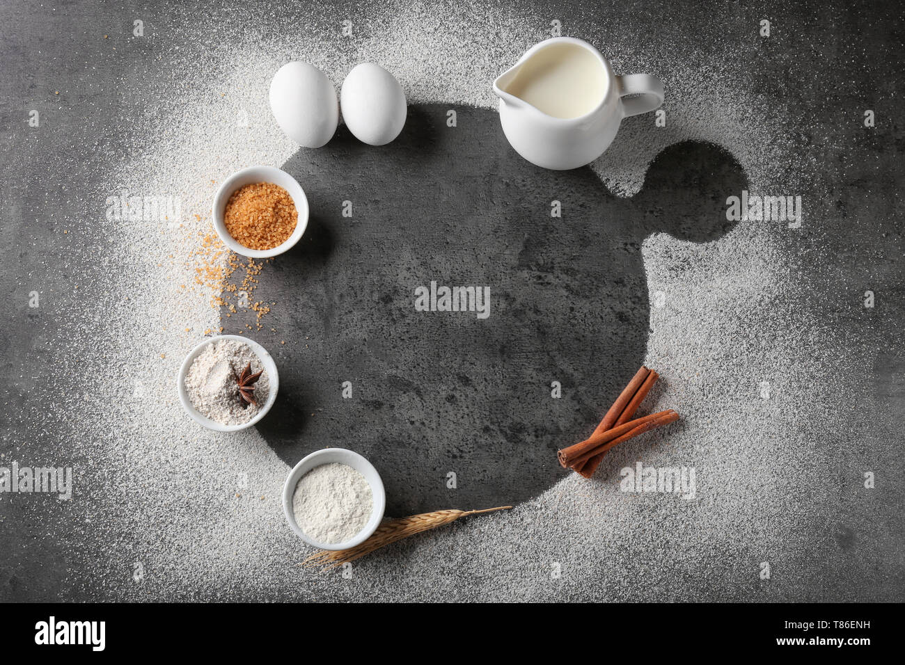 Composition with scattered flour and ingredients on grey background ...