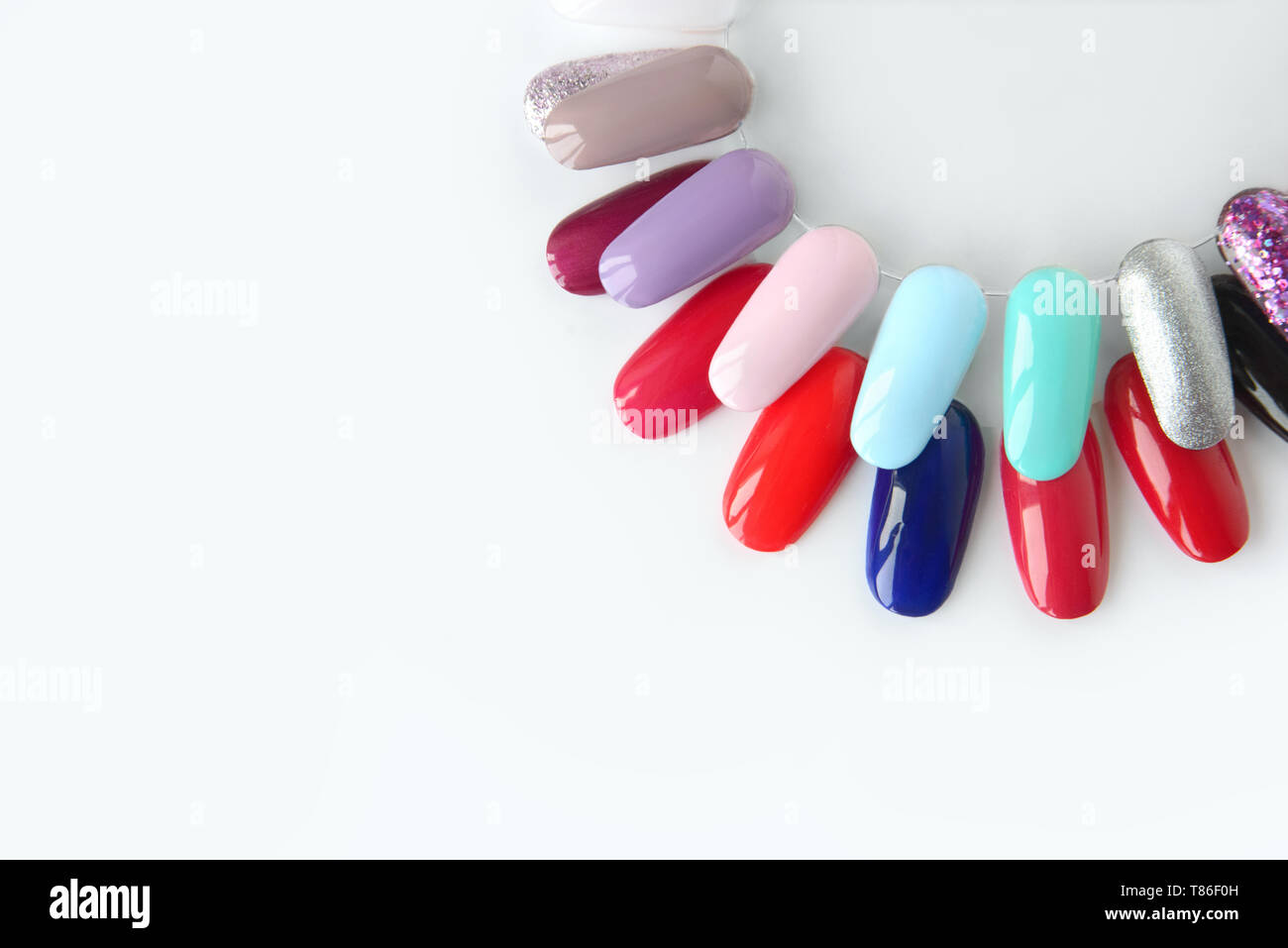 Nail polish samples in different bright colors. Colorful nail lacquer ...