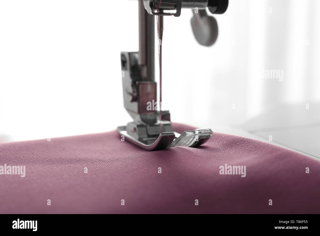 Sewing machine with fabric, closeup Stock Photo - Alamy