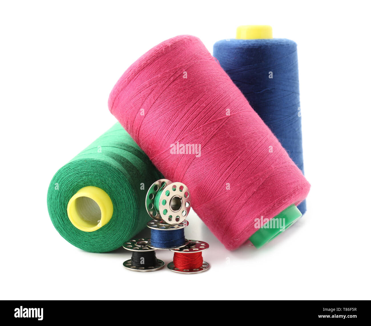 Color sewing threads on white background Stock Photo - Alamy