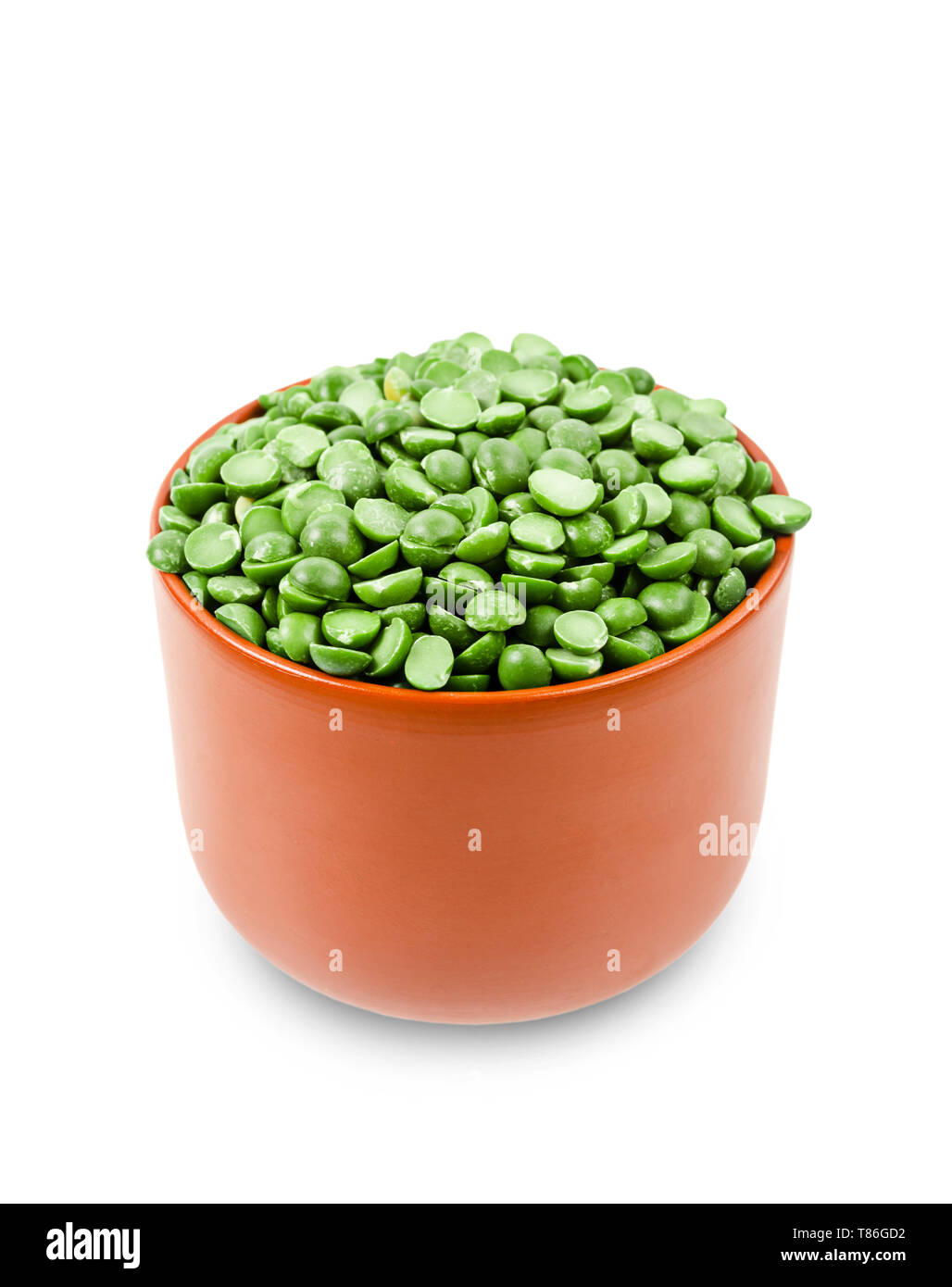 organic green split peas filling a small bowl isolated on a white ...