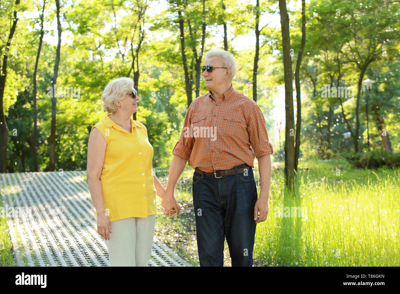 Mature couple walking in spring nature couple walk hi-res stock ...