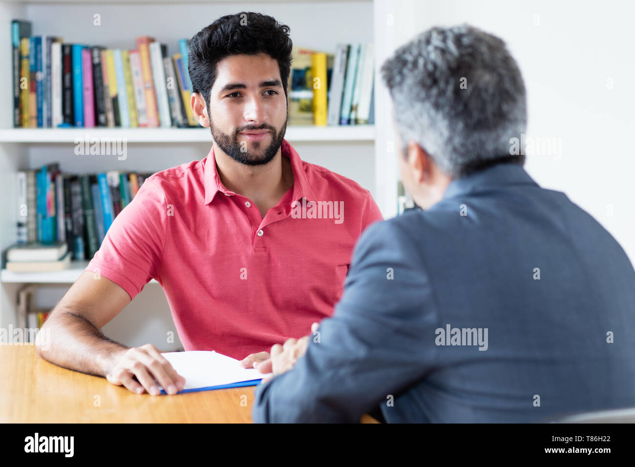 Job interview of turkish male apprentice with businessman at office ...