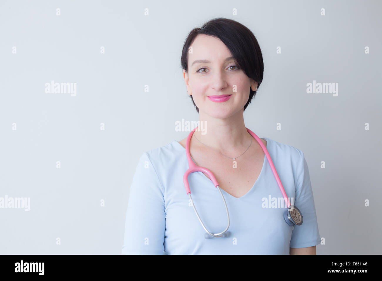Smiling medical doctor woman with stethoscope. Isolated on white Stock ...