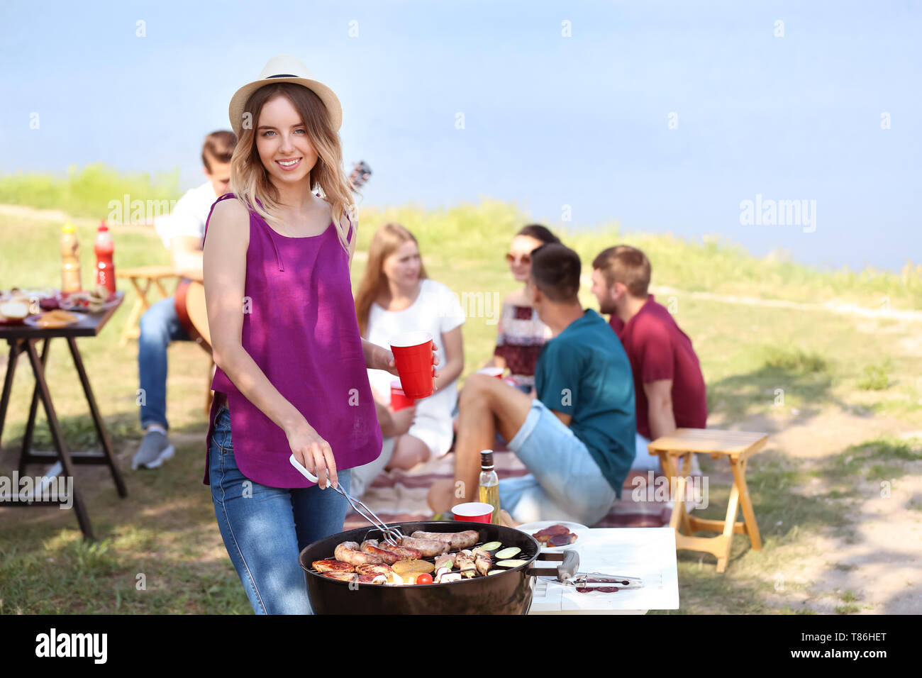 Young woman grill vegetables hi-res stock photography and images - Alamy