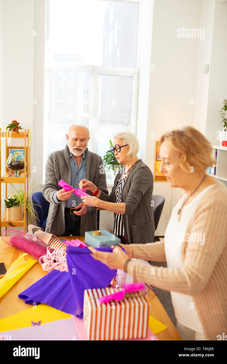 Nice grey haired woman giving advice to her friend Stock Photo - Alamy