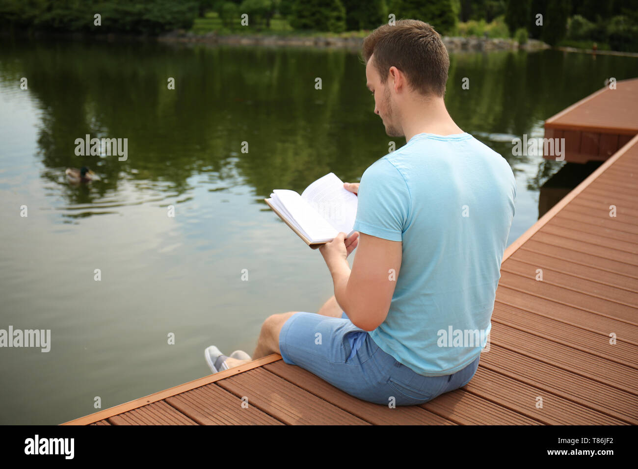 Reading near pond hi-res stock photography and images - Alamy