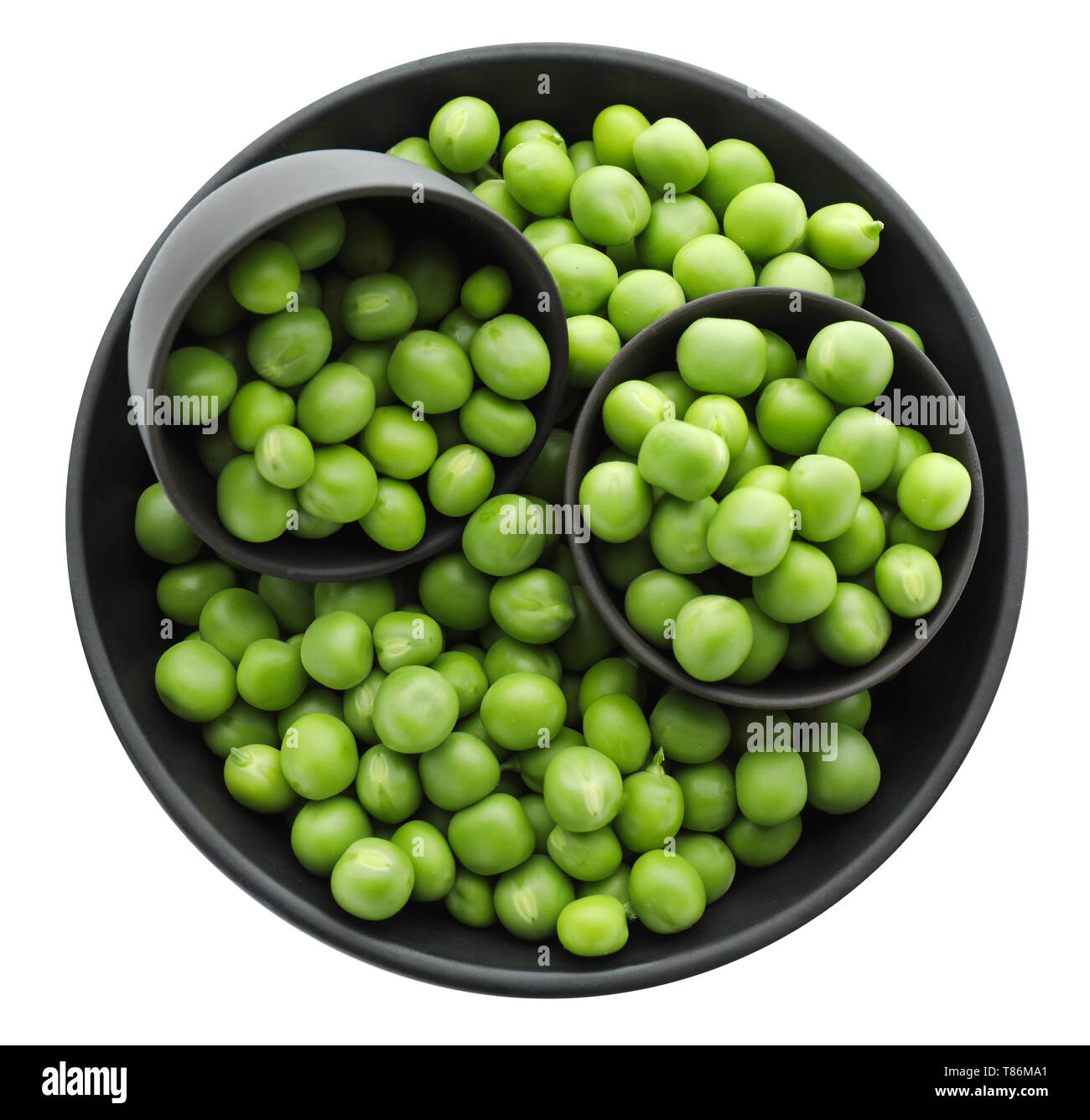 Bowls with green peas on white background Stock Photo - Alamy