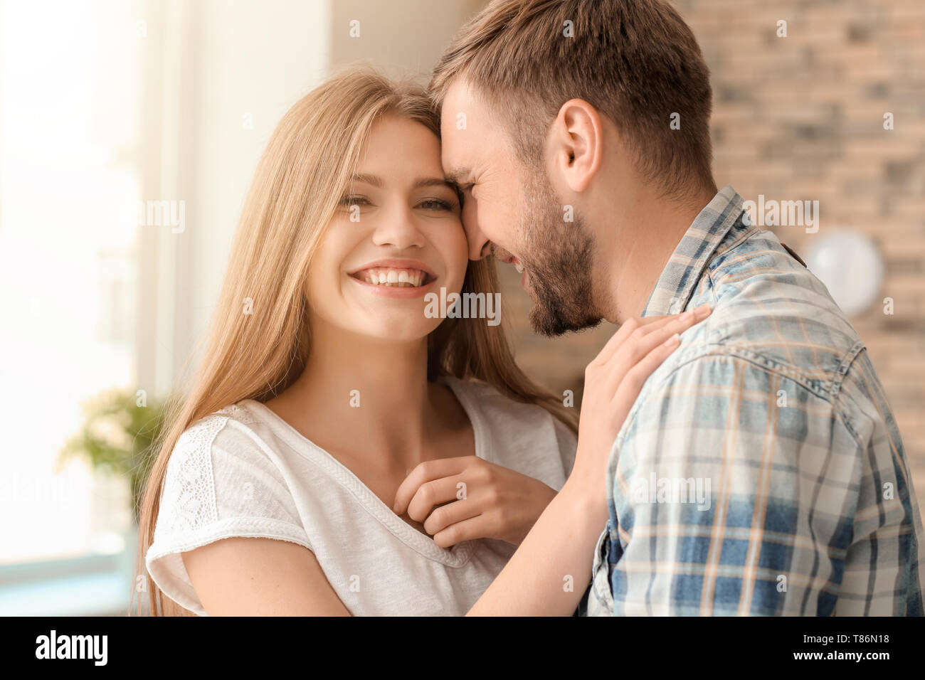Happy loving couple at home Stock Photo - Alamy