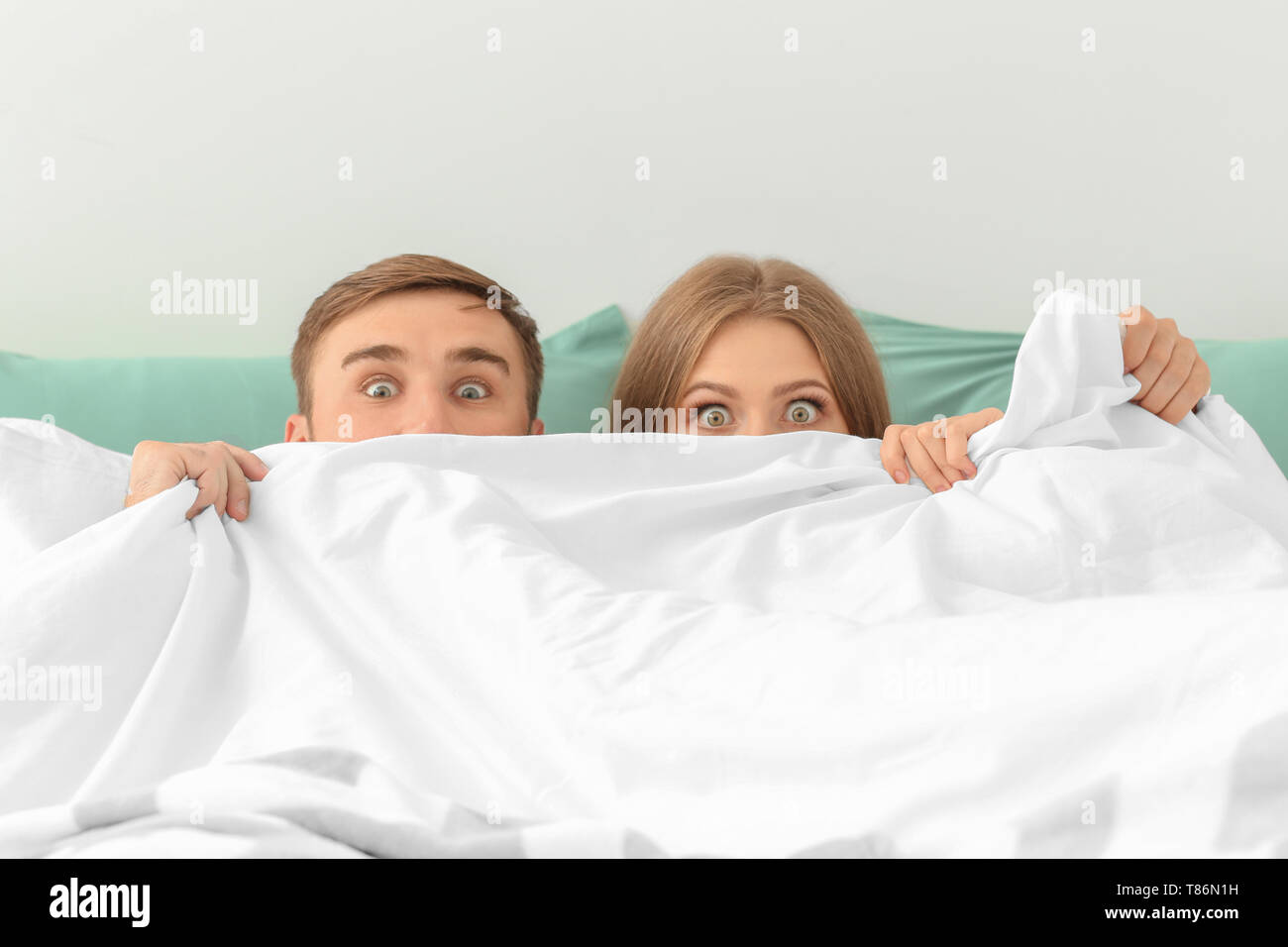 Hiding under bed man woman hi-res stock photography and images - Alamy