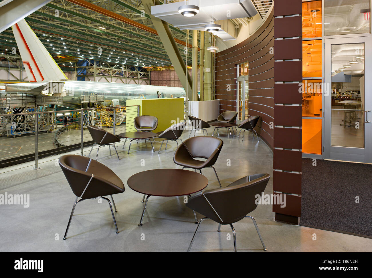 Lounge area in airplane hangar Stock Photo - Alamy