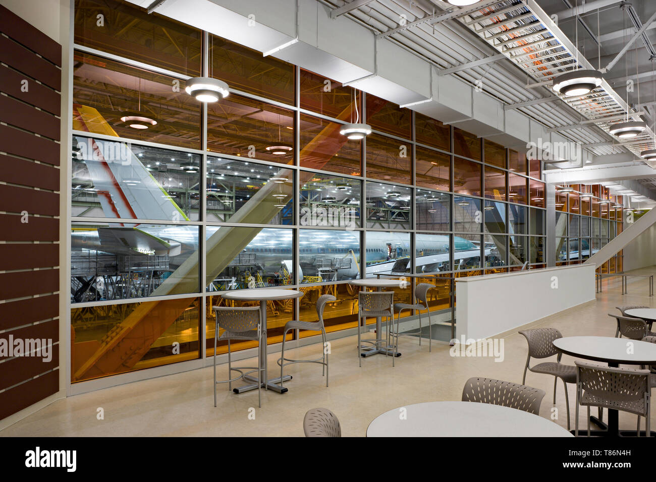 Empty lounge area of airplane hangar Stock Photo - Alamy